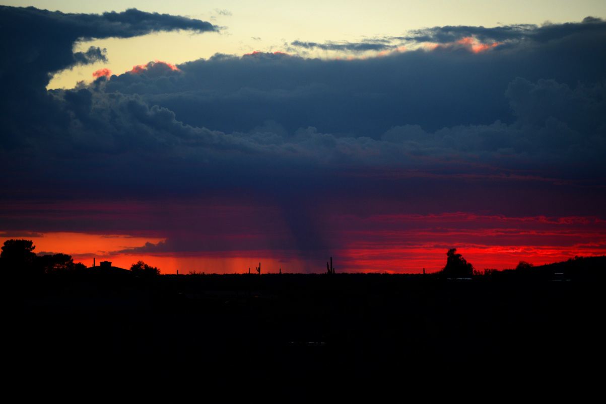 Monsoon Season Creates A Beautiful Sunset Cut Through By Curtains Of ...